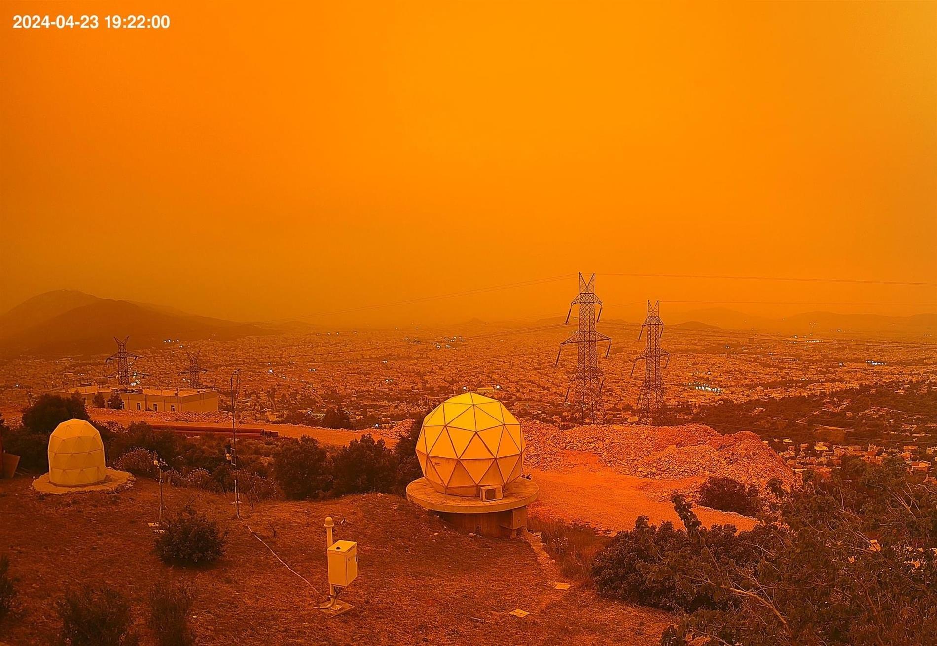 Saharan dust gives the sky over Athens, Greece bright orange hues (no ...